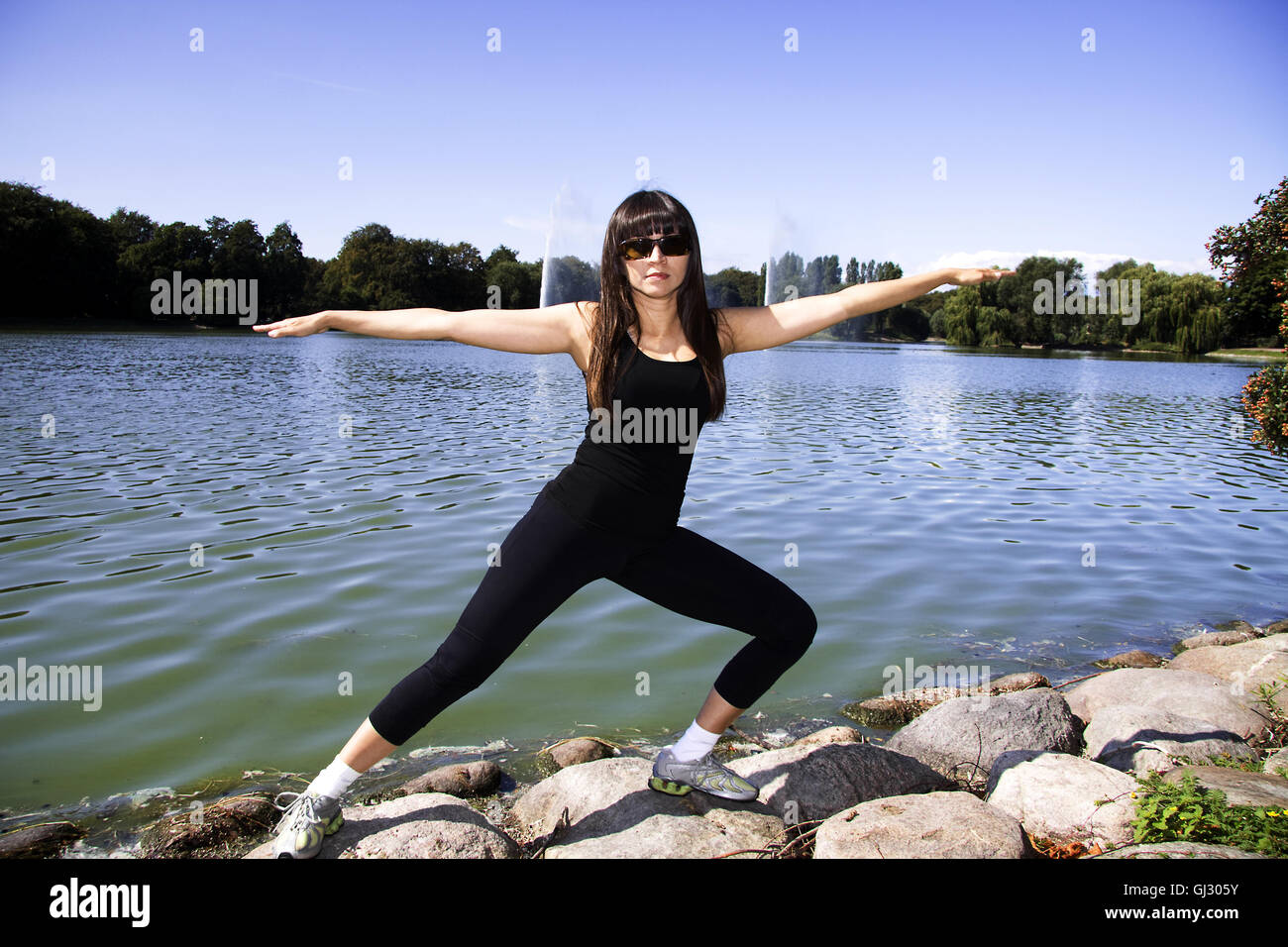 Woman doing a full stretch Stock Photo - Alamy