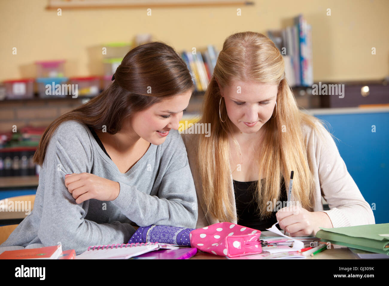 Two schoolgirls in class Stock Photo - Alamy