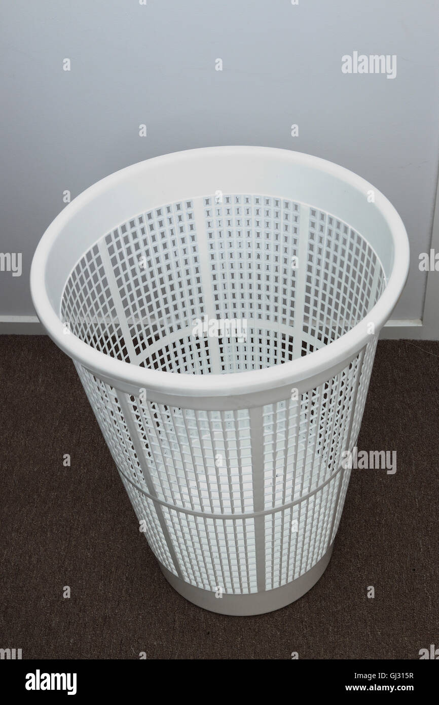 Empty white laundry basket Stock Photo - Alamy