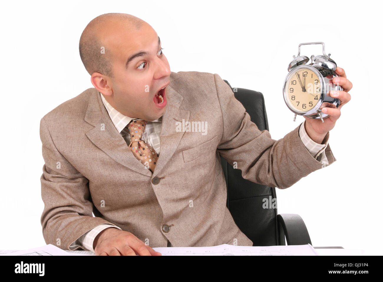 Confused businessman looking watch hi-res stock photography and images ...