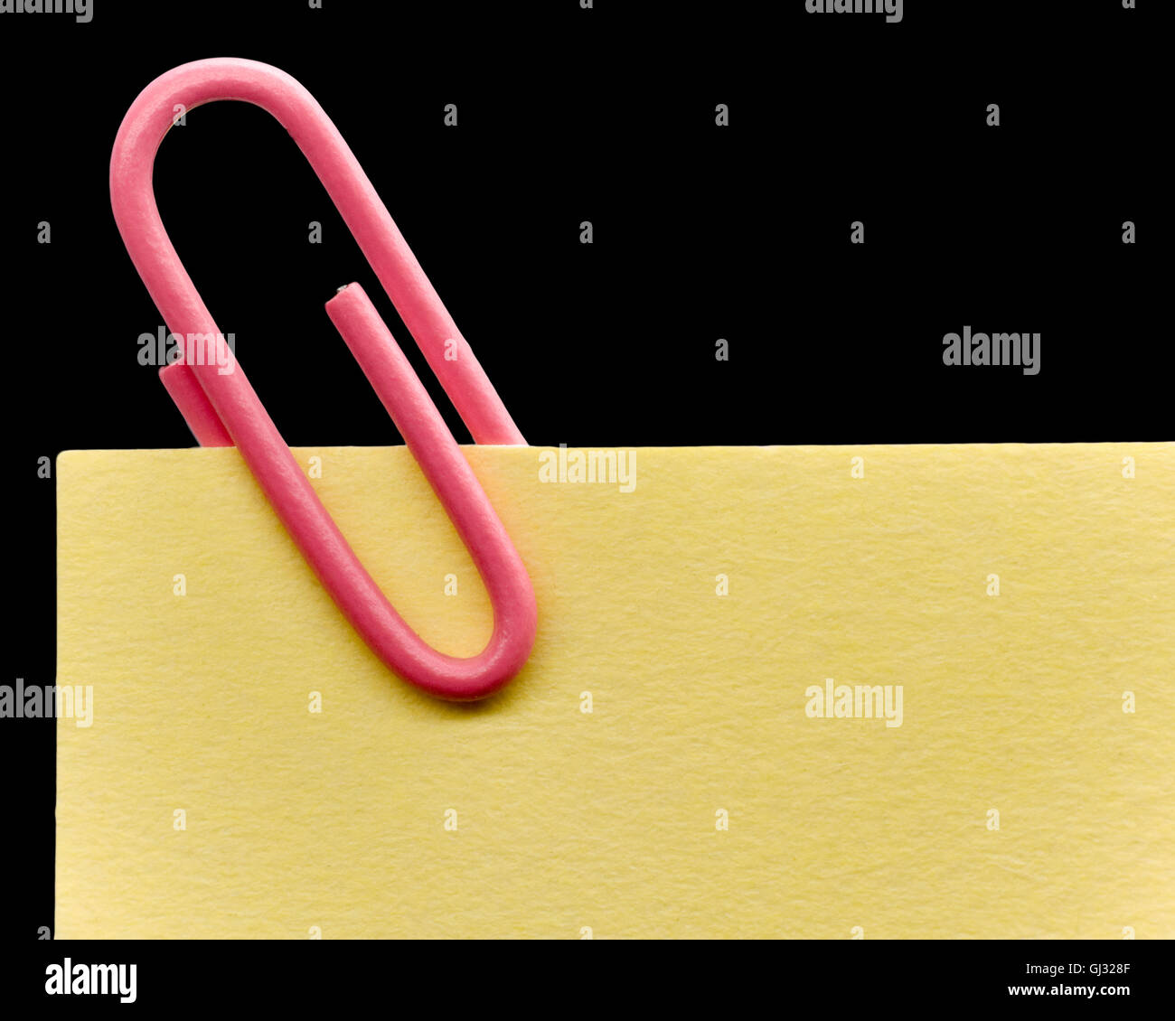 Paperclip on a note Stock Photo - Alamy