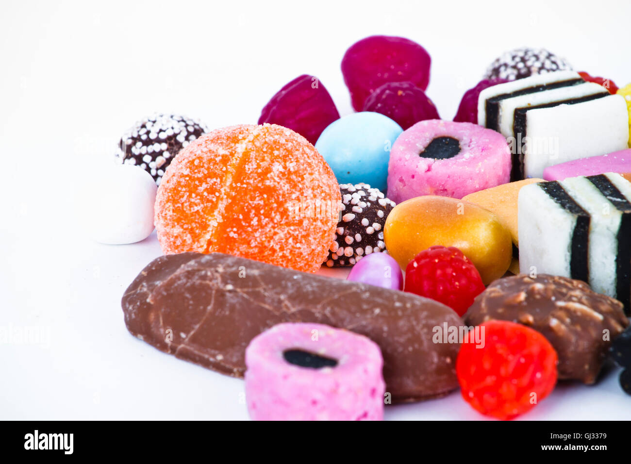 Many candy on white background.Candy colors Stock Photo - Alamy
