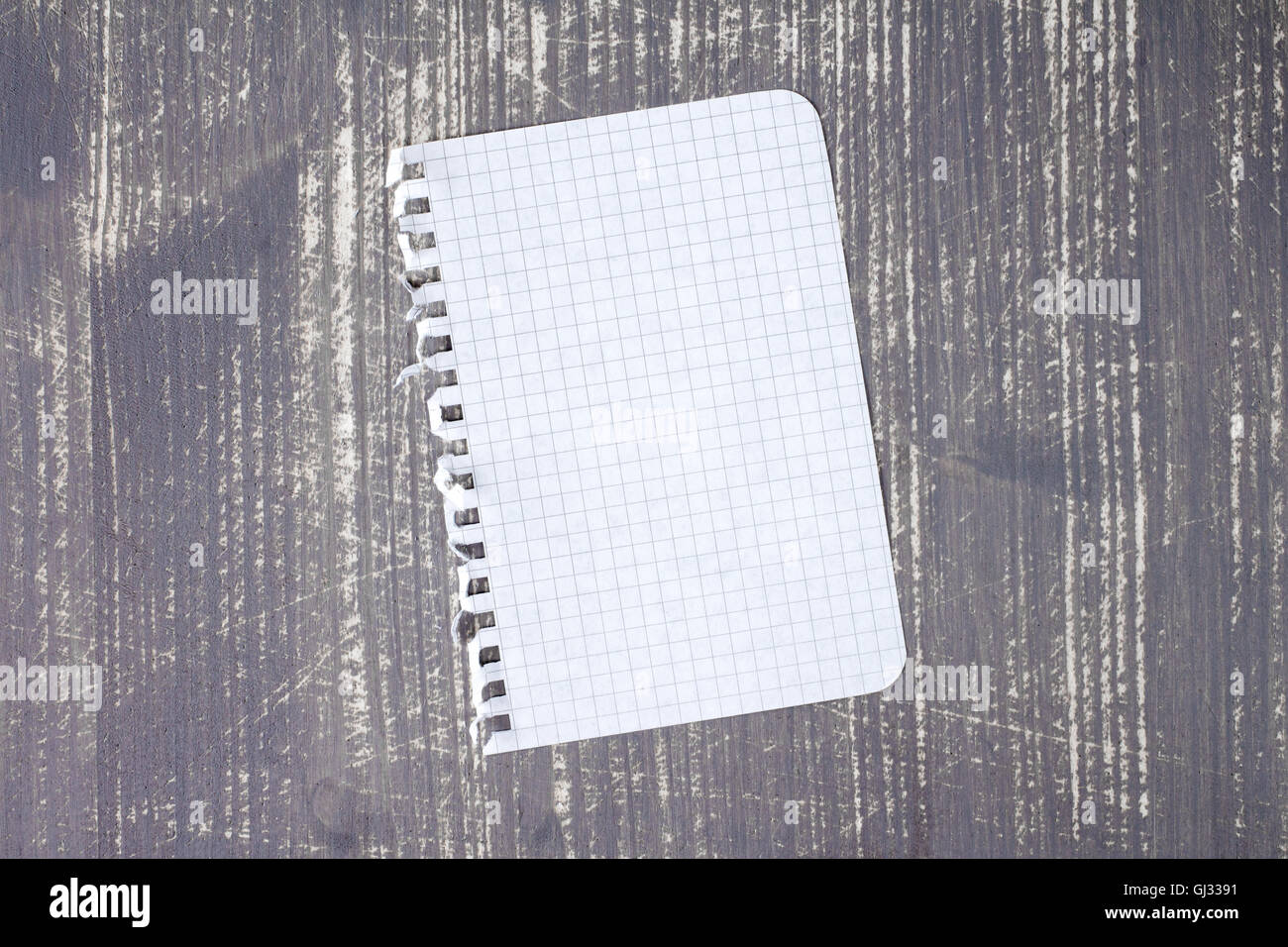 Blank notebook paper on grey wood background Stock Photo - Alamy