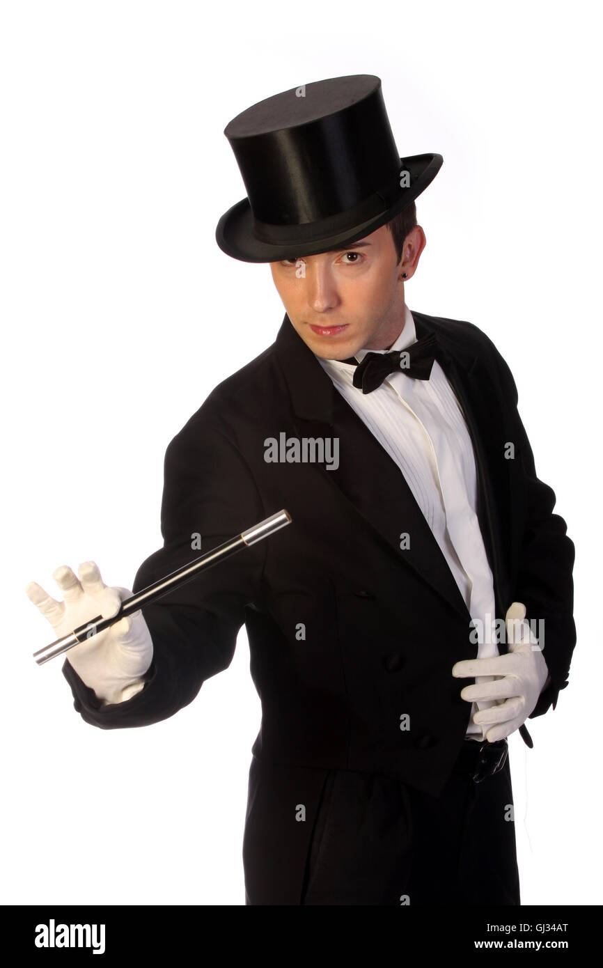 young magician performing with wand Stock Photo - Alamy