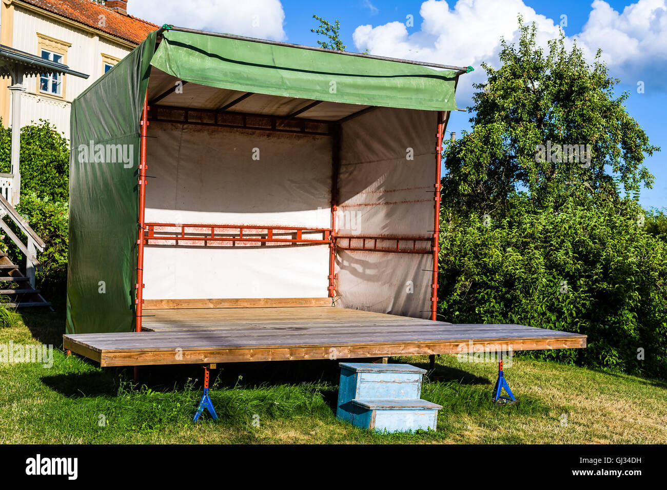 Makeshift Stage In A Rural Garden Stage Is Made Of Garage Jacks 