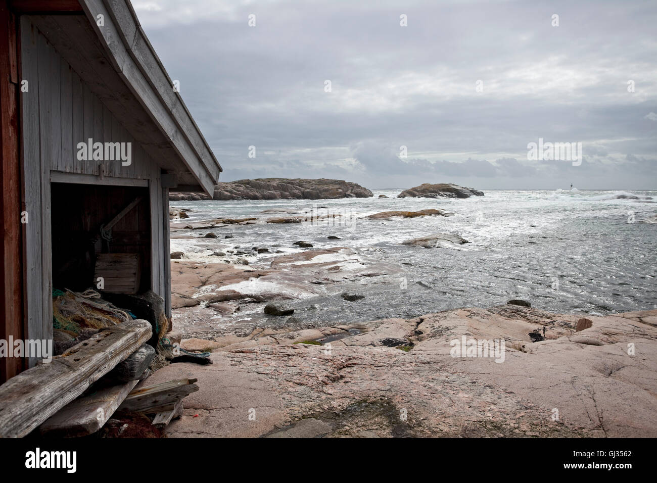 hut on a beach on a windy day Stock Photo - Alamy