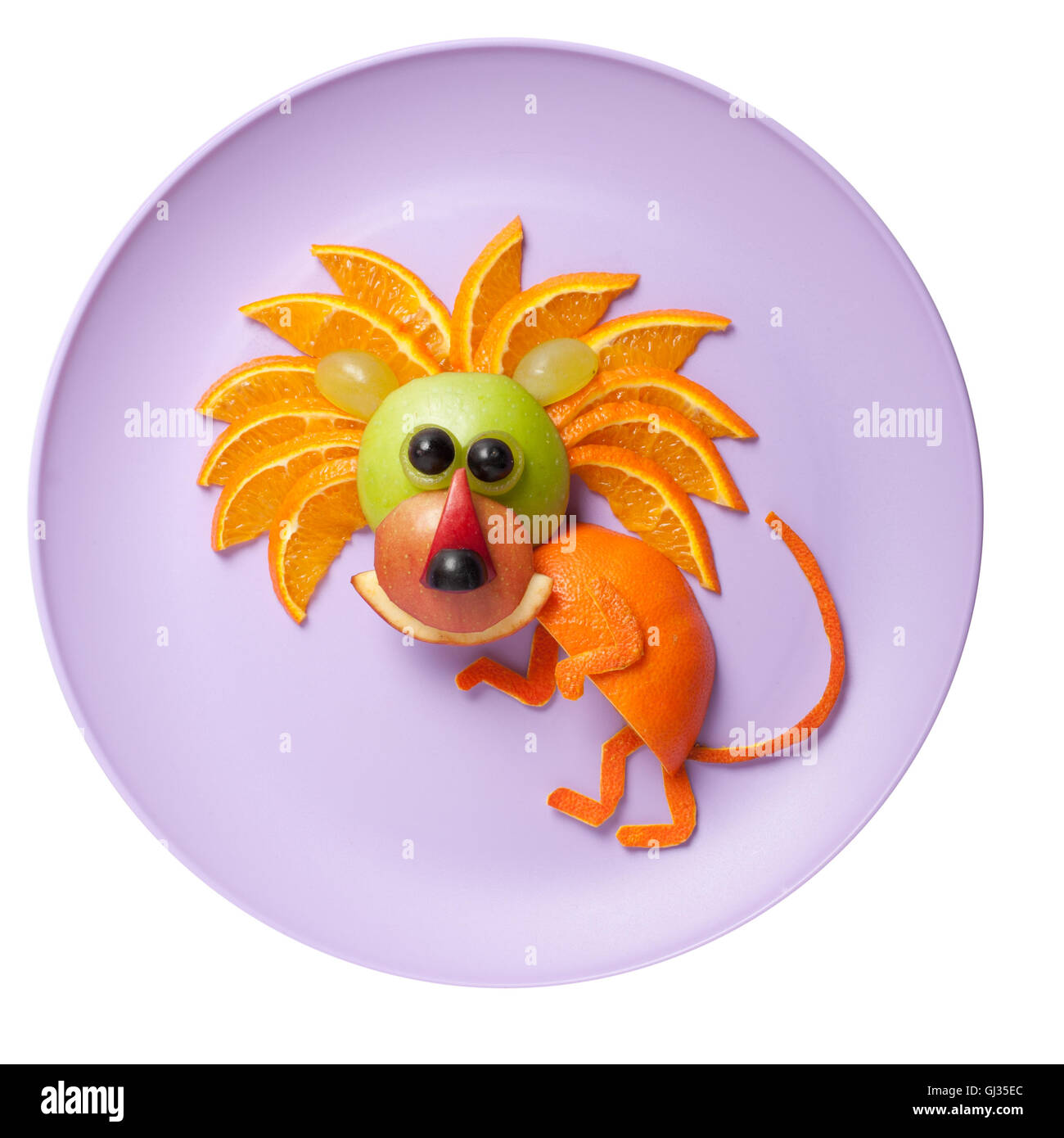 Sneaky lion made of orange and apple on plate Stock Photo - Alamy