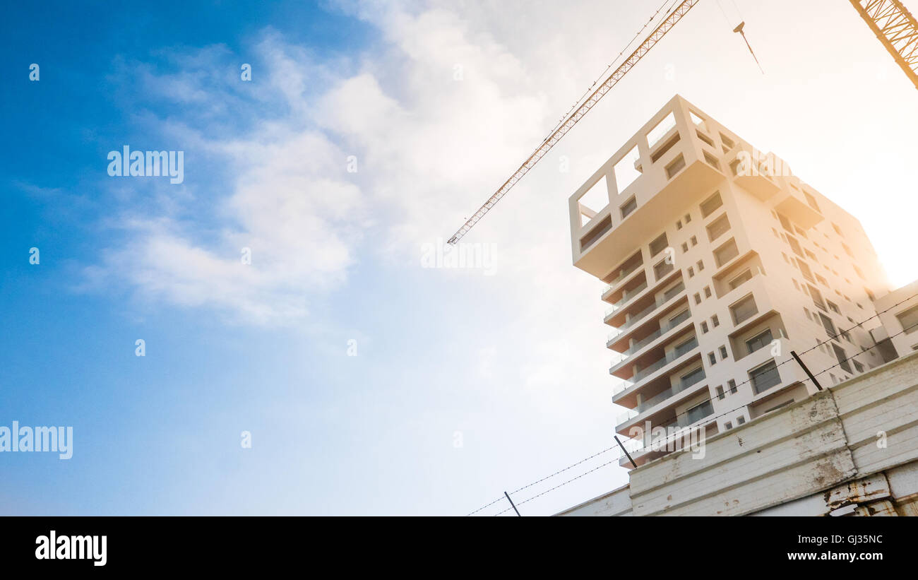 One building reaching to the sky being developed and finished up Stock ...