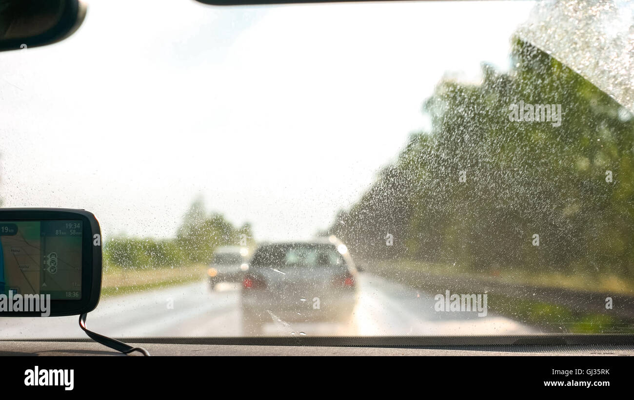 Car being driven fast on the highway road after rain Stock Photo - Alamy