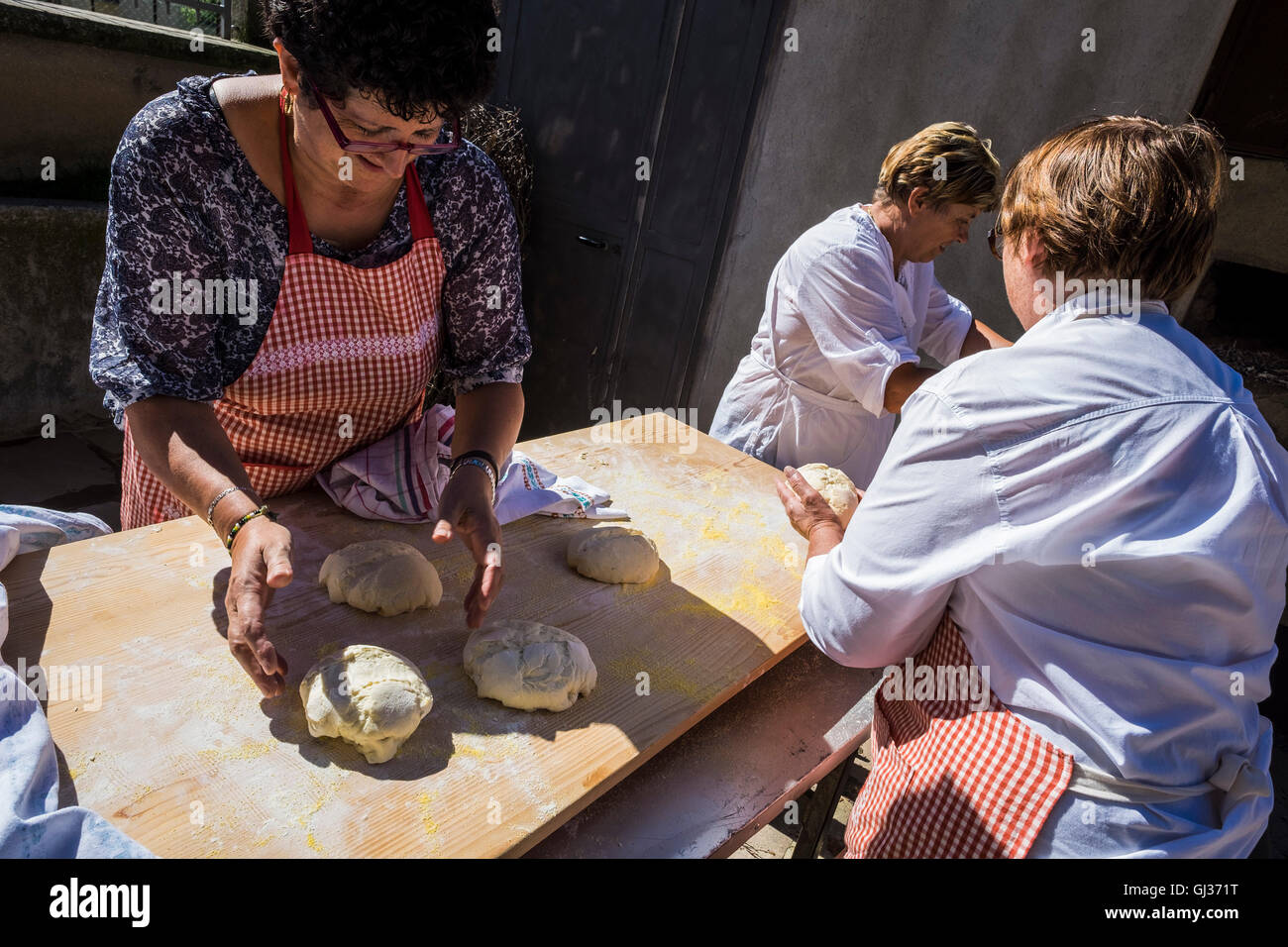 Italy, Bossico, bread-making Stock Photo - Alamy