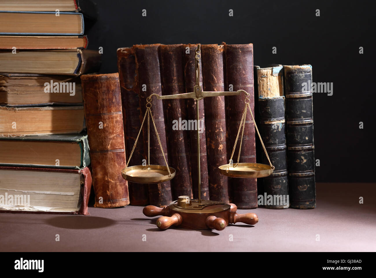 Old brass weight scales on cover books background Stock Photo - Alamy