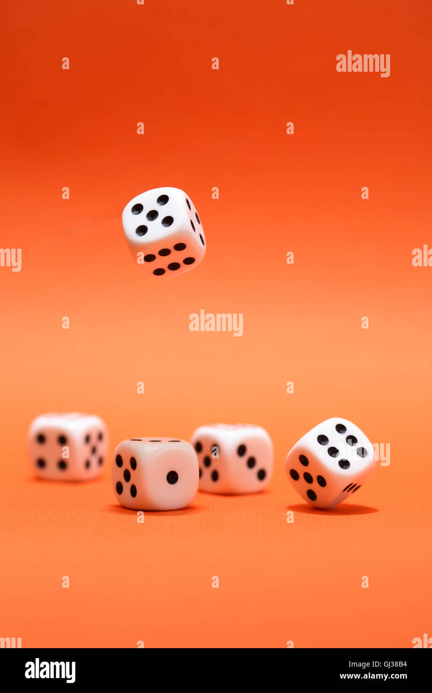 Dice game. One dice cube falling to another dices on red background ...