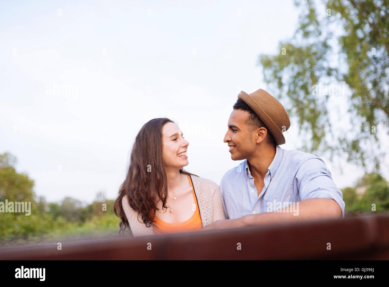 Young couple face to face smiling Stock Photo - Alamy