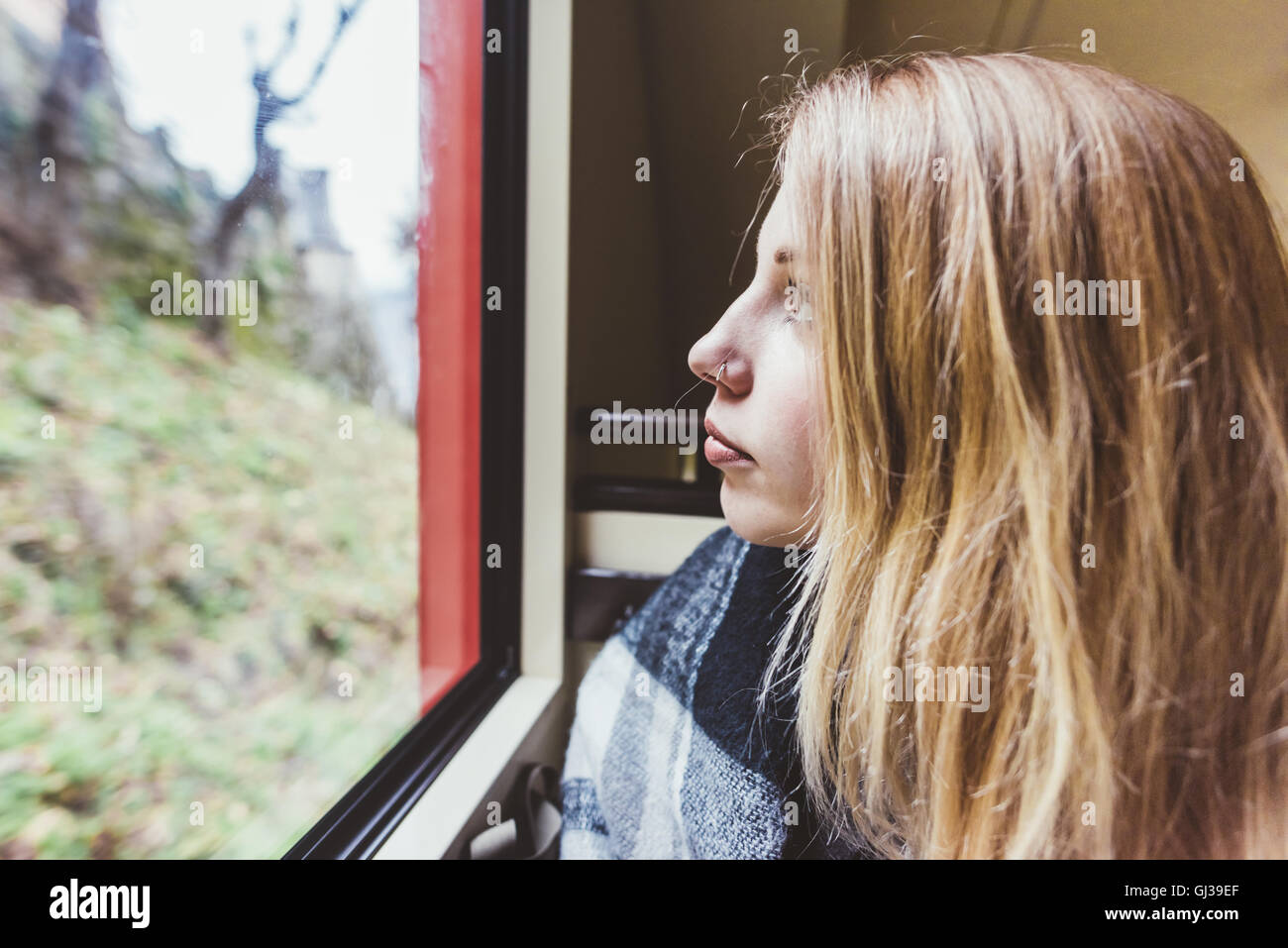 Young woman staring through funicular window, Como, Italy Stock Photo ...