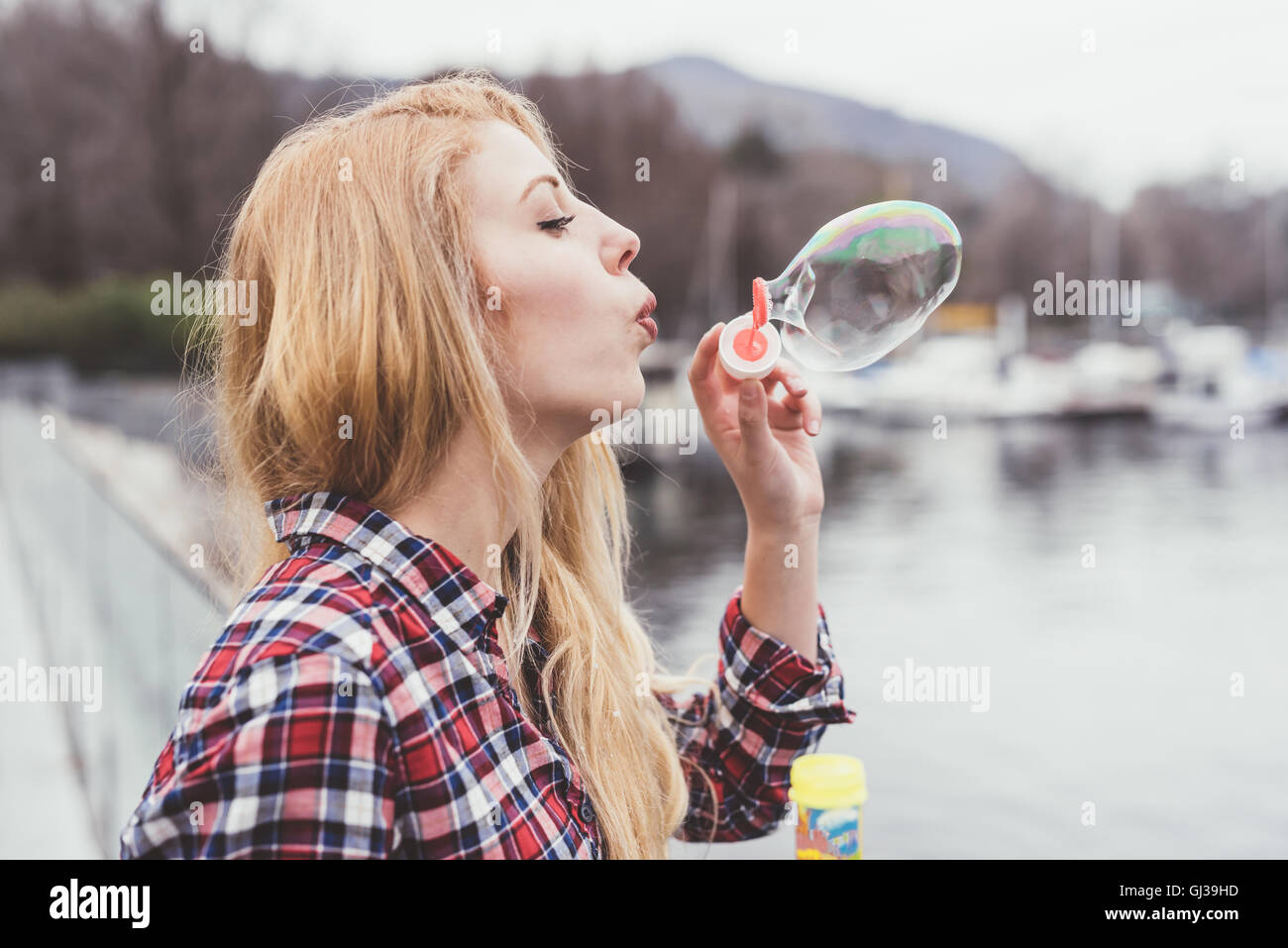 Woman Blowing Bubbles Lake