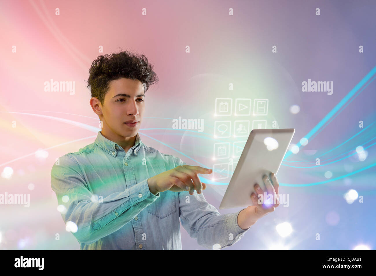 Young man using digital tablet Stock Photo - Alamy
