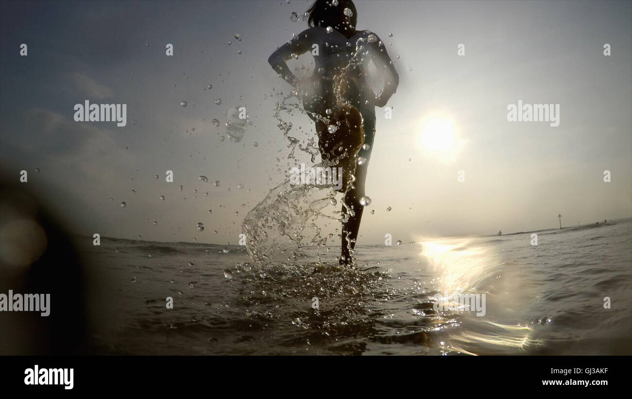 Woman splashing in water hi-res stock photography and images - Alamy