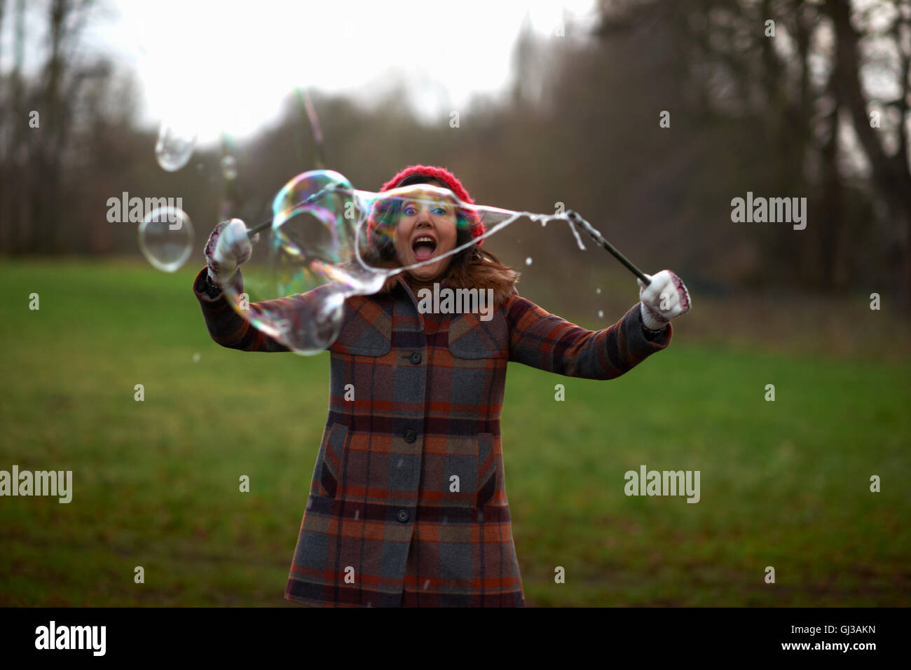 Mature woman blowing bubbles hi-res stock photography and images - Alamy