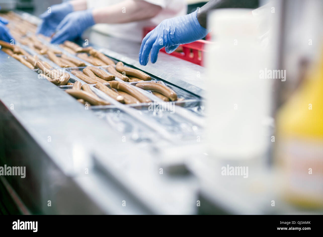 Factory workers on tofu sausage production line Stock Photo - Alamy
