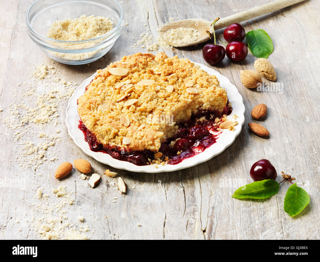 Sour cherry and almond crumble pudding, almonds, cherries, white washed ...