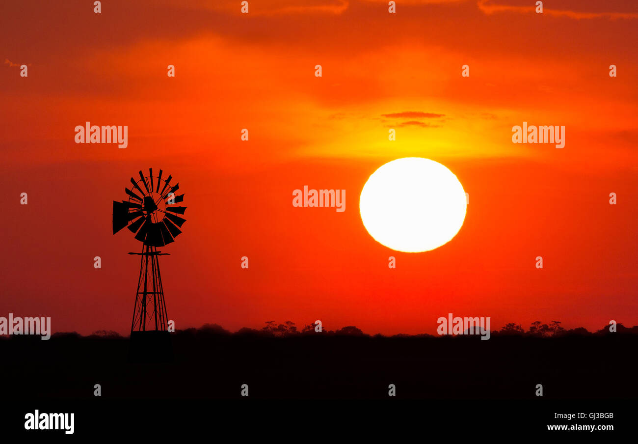 Windmill at sunset, Etosha National Park, Namibia Stock Photo - Alamy