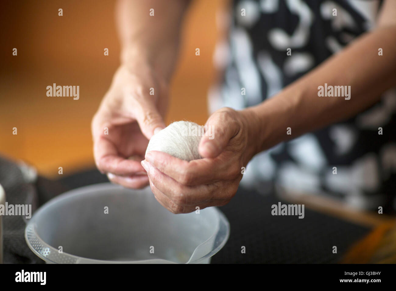Woman washing wool for felting Stock Photo - Alamy