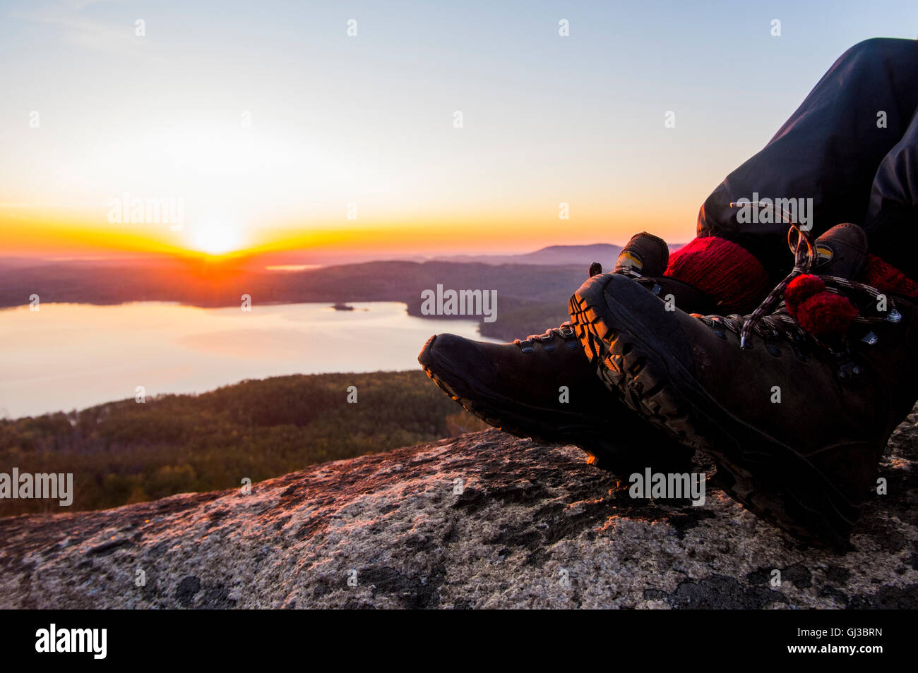 Tourist enjoying view of lake at sunset Stock Photo - Alamy