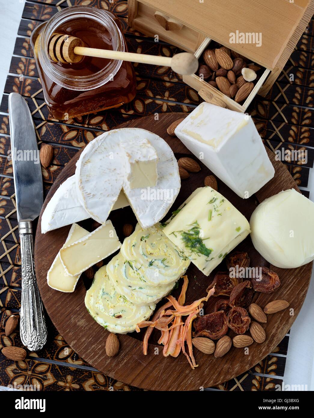 Cheese platter with assorted cheese and nuts Stock Photo - Alamy