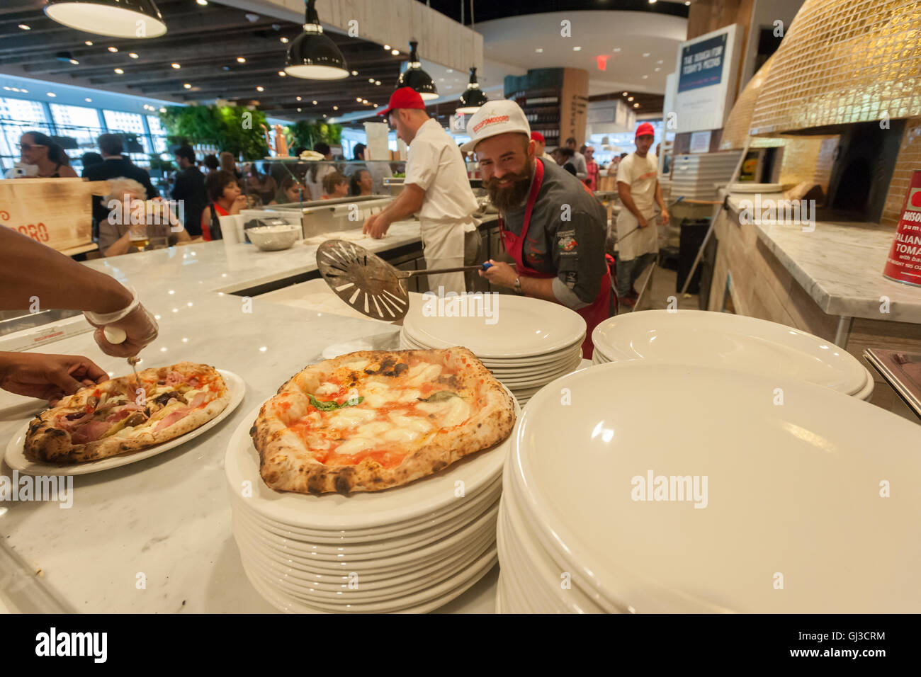 Pizza pies prepared grand opening hi-res stock photography and images ...