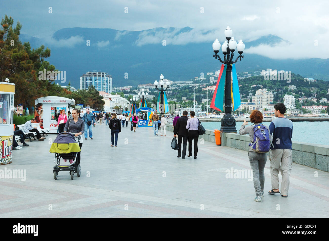 YALTA, CRIMEA,UKRAINE - MAY 25: tourists are walking along seafront of ...