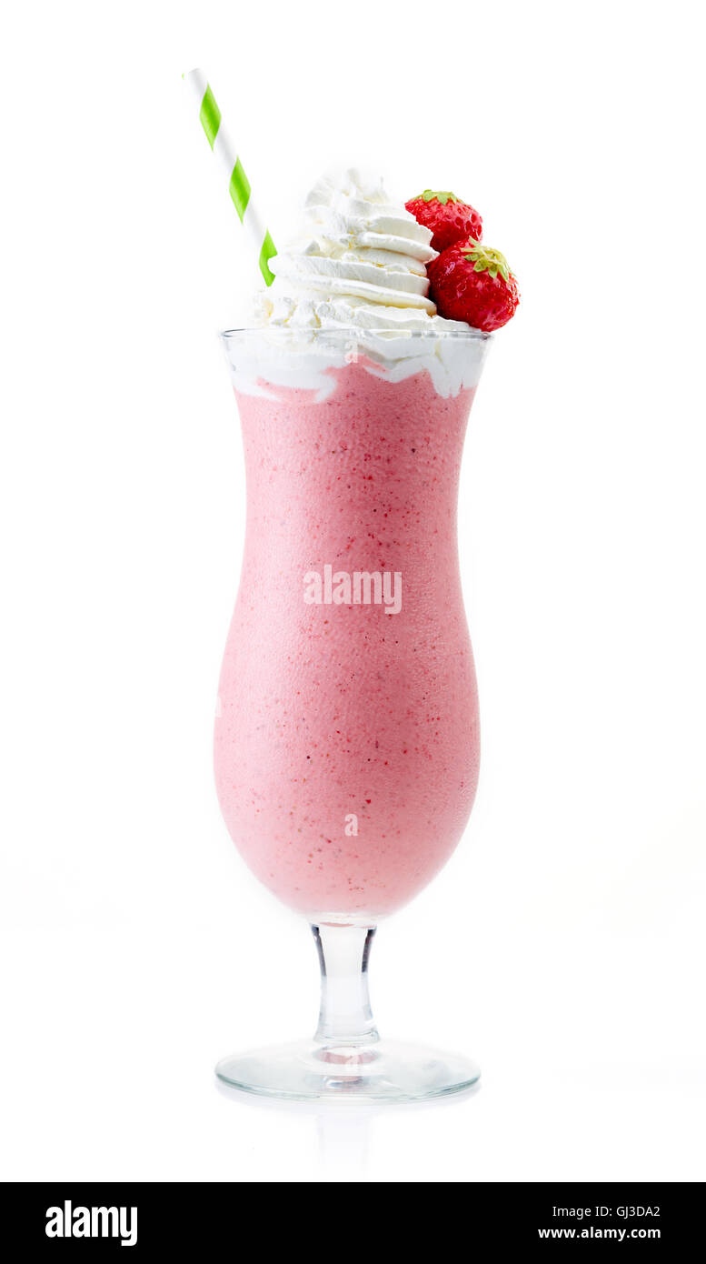 Glass of strawberry milkshake with whipped cream and fresh strawberries ...