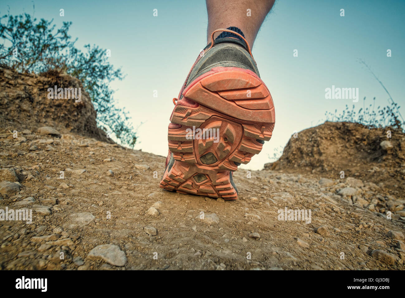 Low angle viewpoint take of the soles of a cross country runner Stock ...