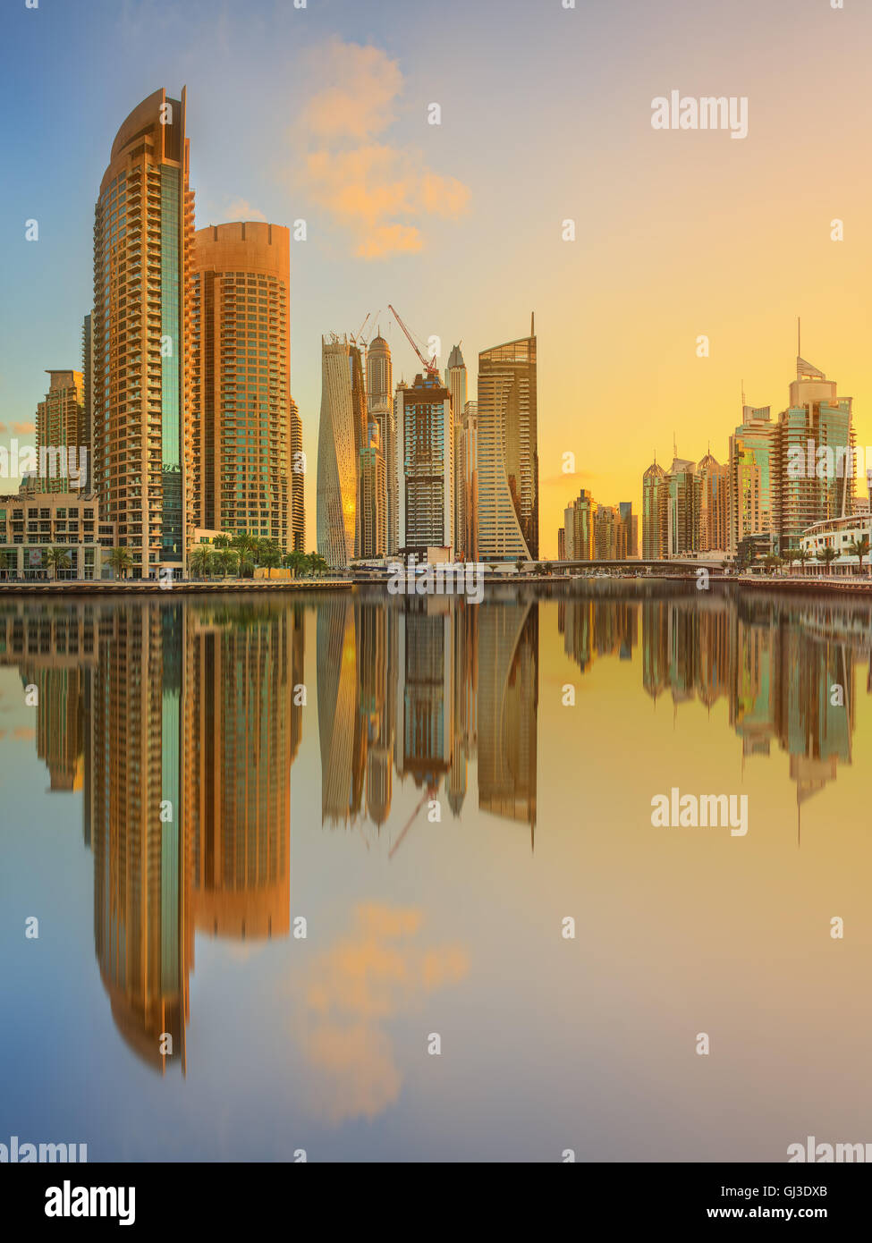 Panoramic view of Dubai Marina bay with yacht and cloudy sky, Dubai ...