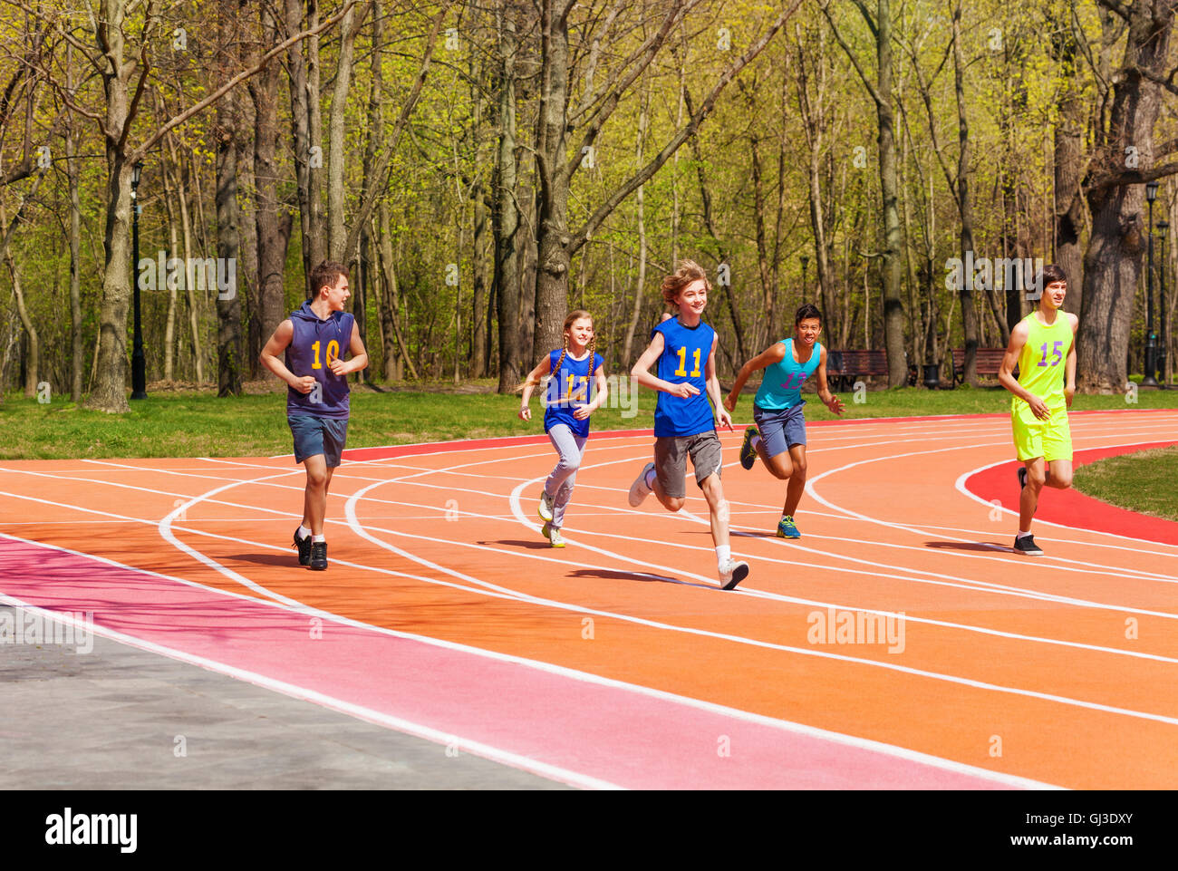 Teenage Boy And Girl Athletics Track High Resolution Stock Photography ...