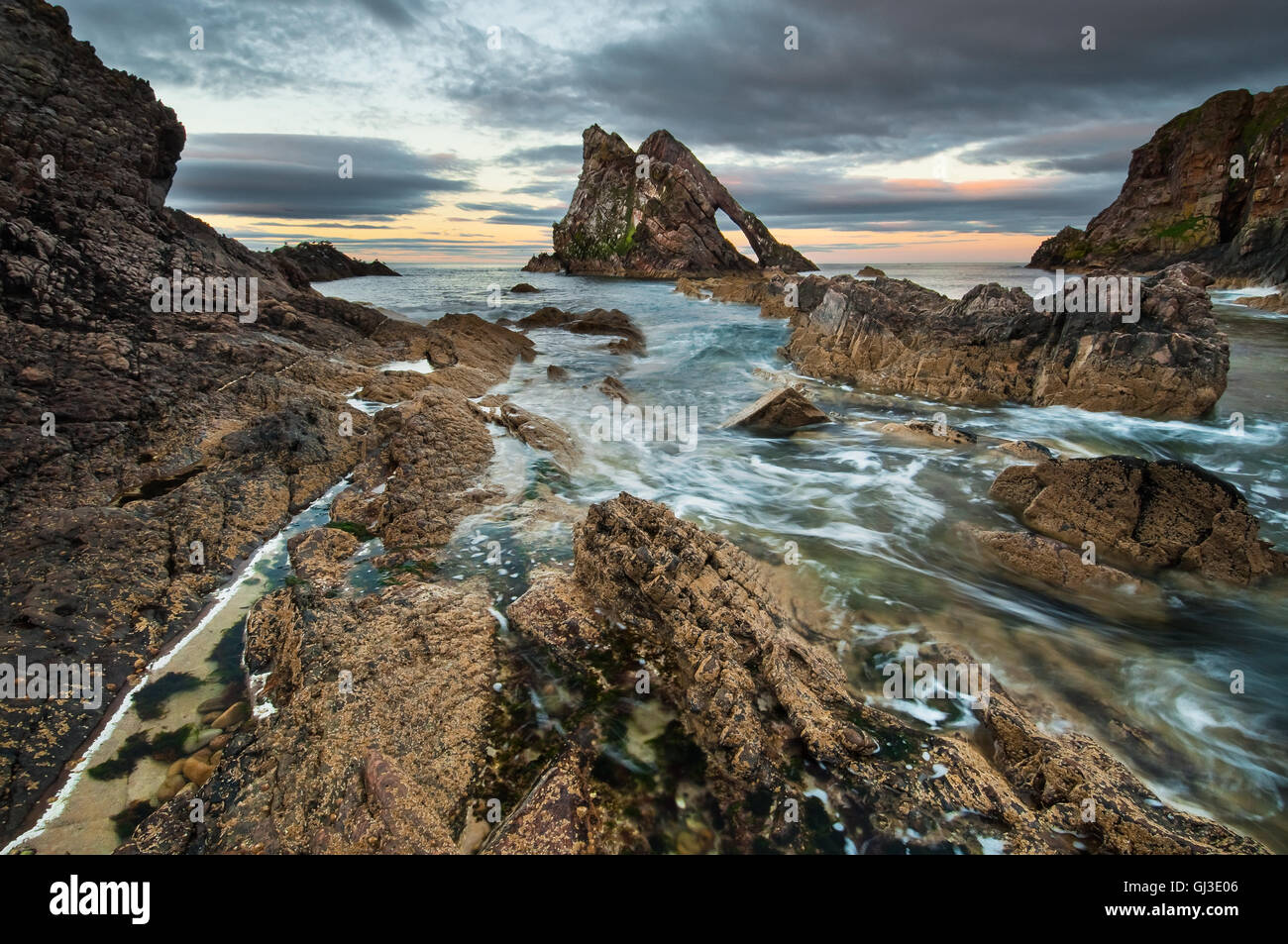 Dramatic image of Bow Fiddle Rock. Portknockie, Scottish coast Stock ...