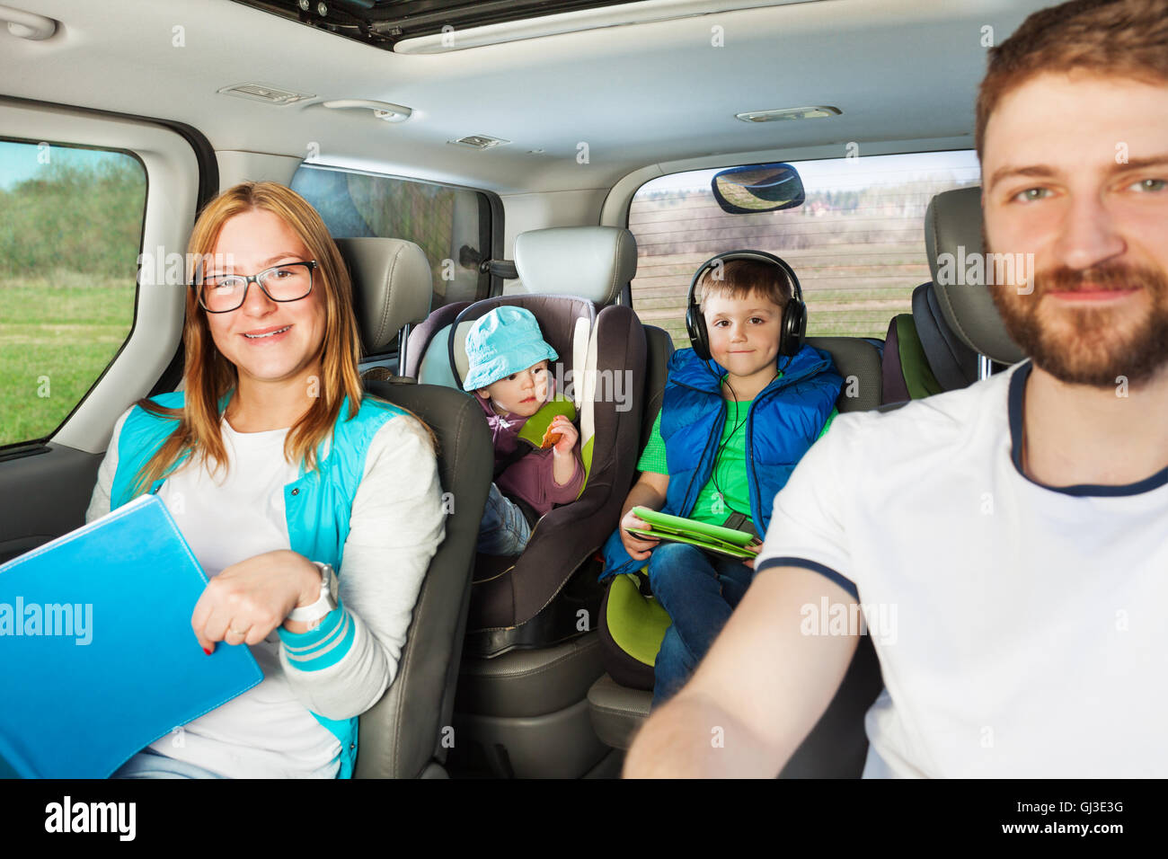 Portrait happy family inside car hi-res stock photography and images ...