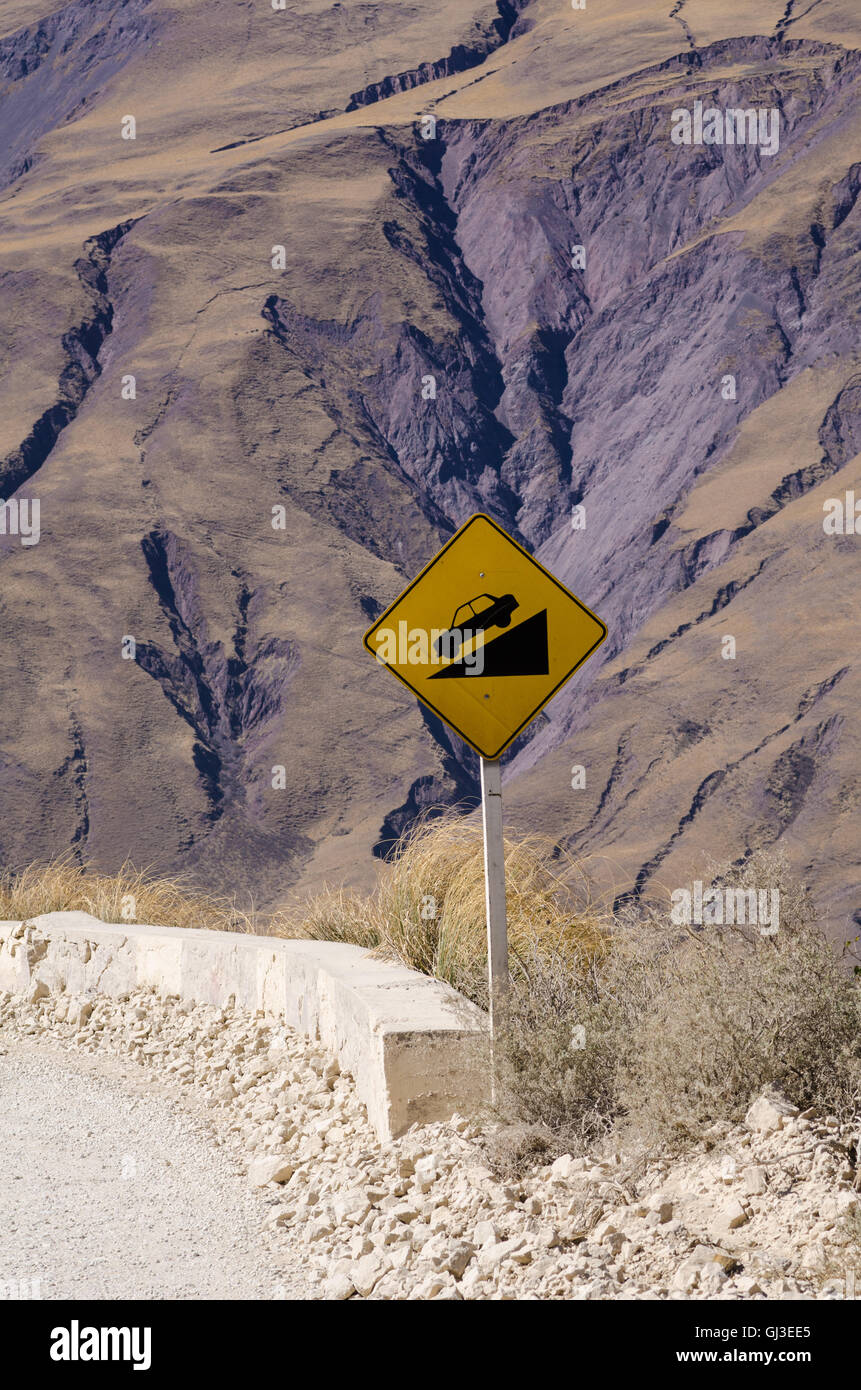 Sign warning of a steep descent on an Andean road Stock Photo - Alamy