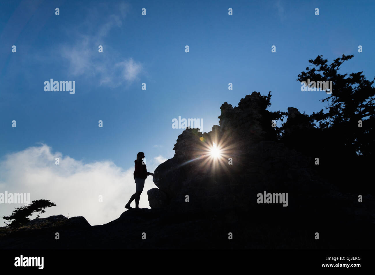 Woman standing on the rock next to Buffavento castle in Kyrenia ...