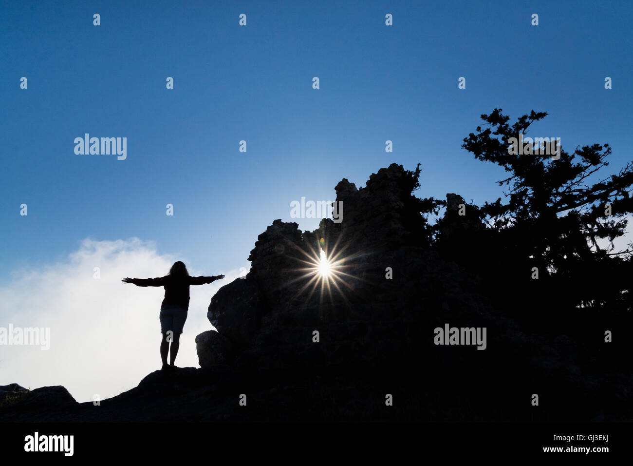 Woman standing on the rock next to Buffavento castle in Kyrenia ...