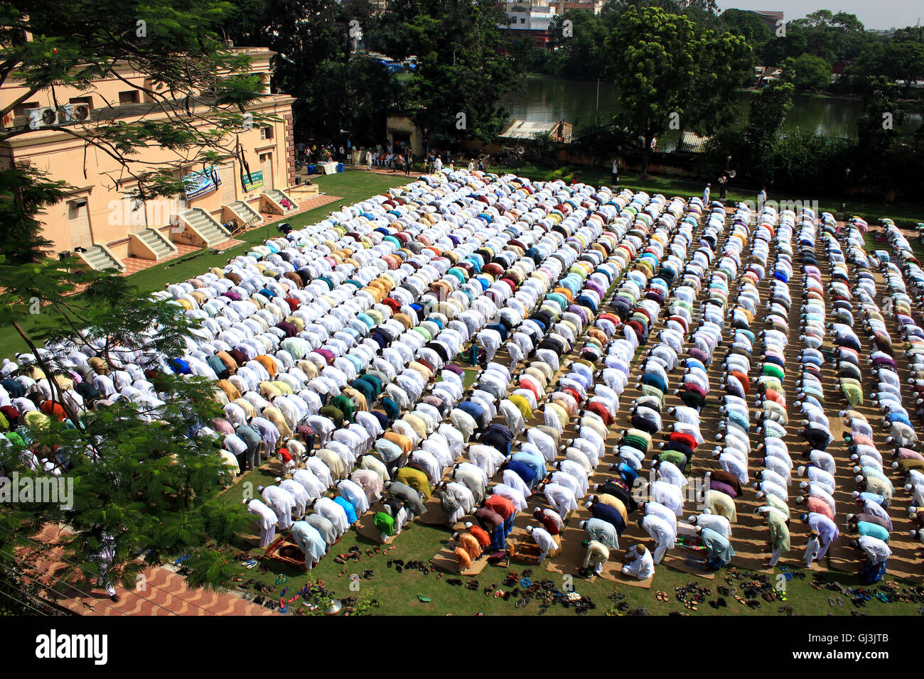 Muslim prayer. A group of Muslim are praying. They wear-ed different ...