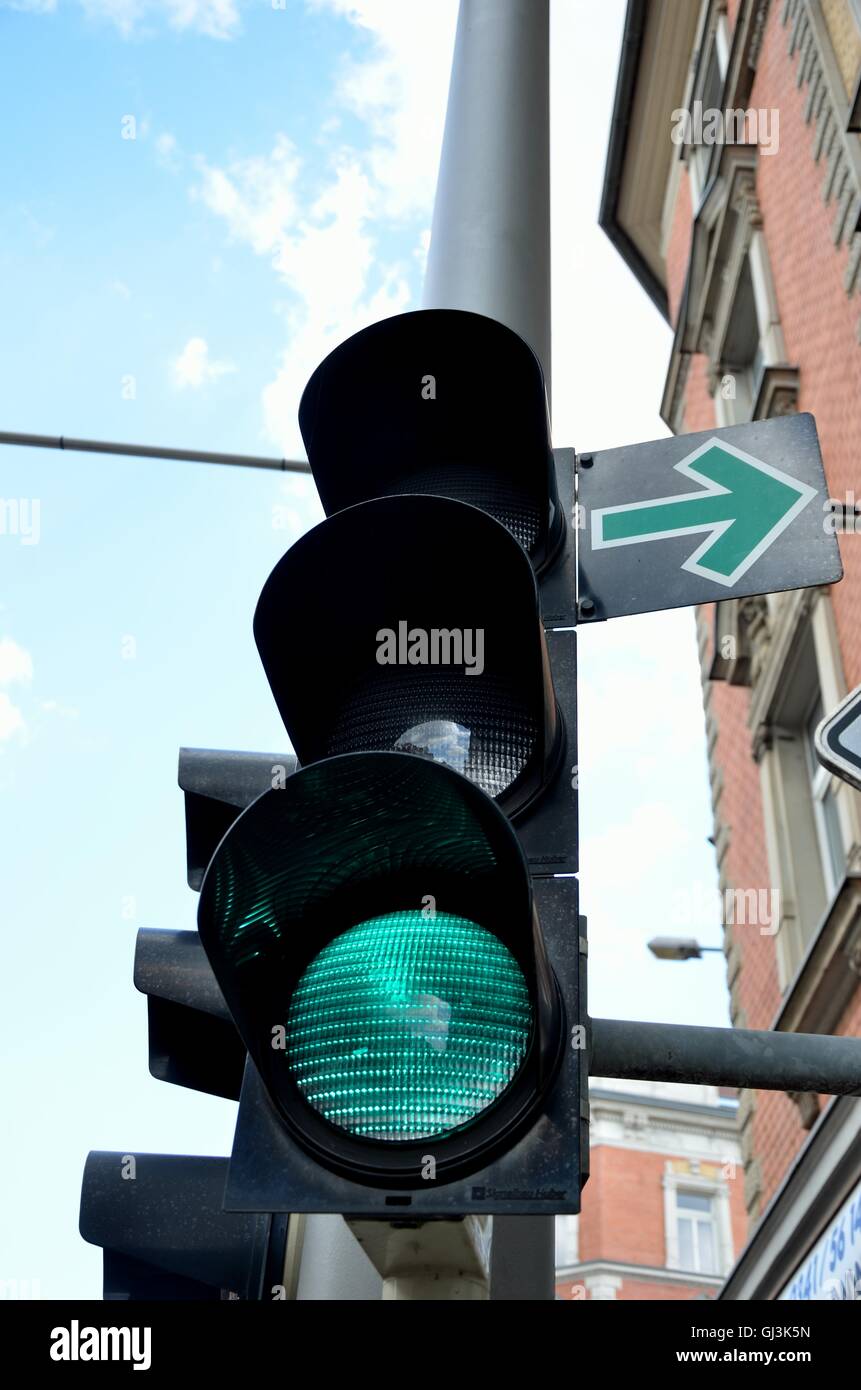 Green traffic light and green arrow Stock Photo - Alamy