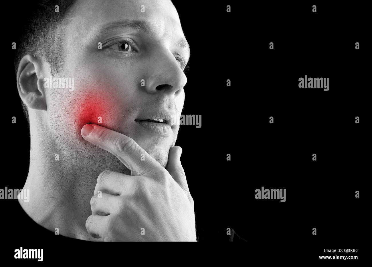 Face portrait of young adult man with strong toothache. Black and white ...