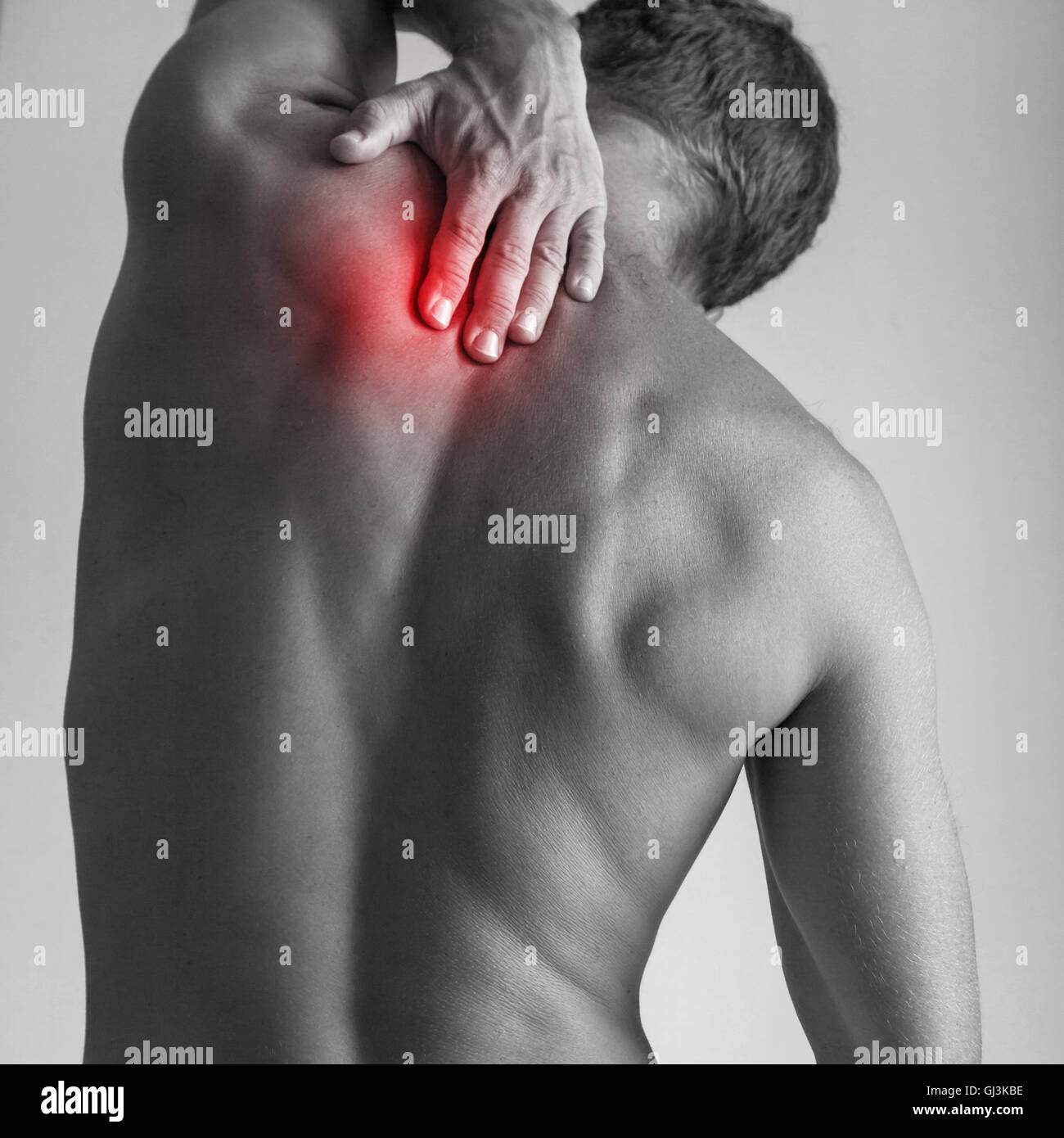 Young adult man with backache. Square black and white stylized photo ...