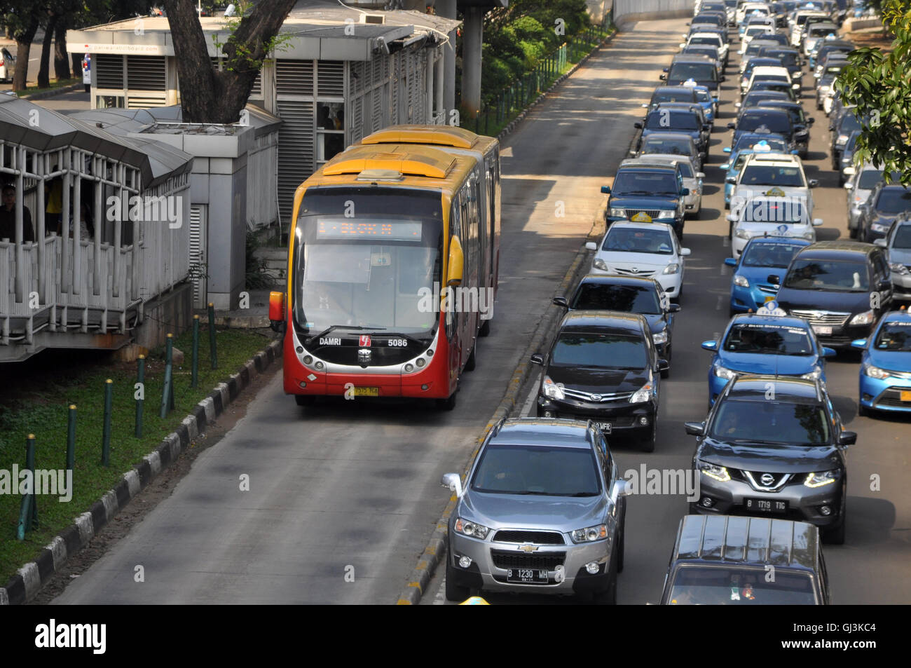 Transjakarta bus was passing in a special line Sudirman street, Jakarta ...