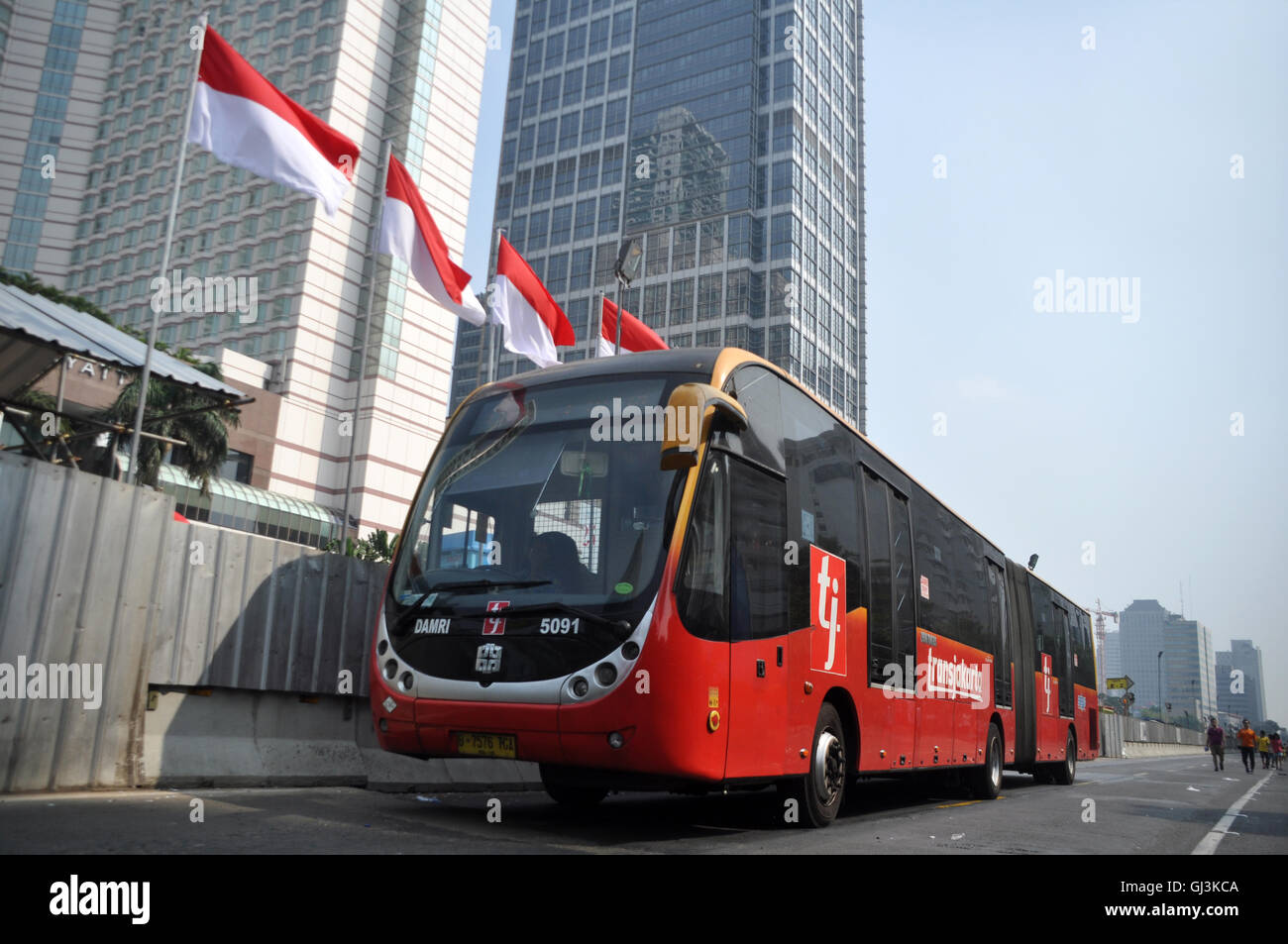 Transjakarta bus was passing in a special line Sudirman street, Jakarta ...