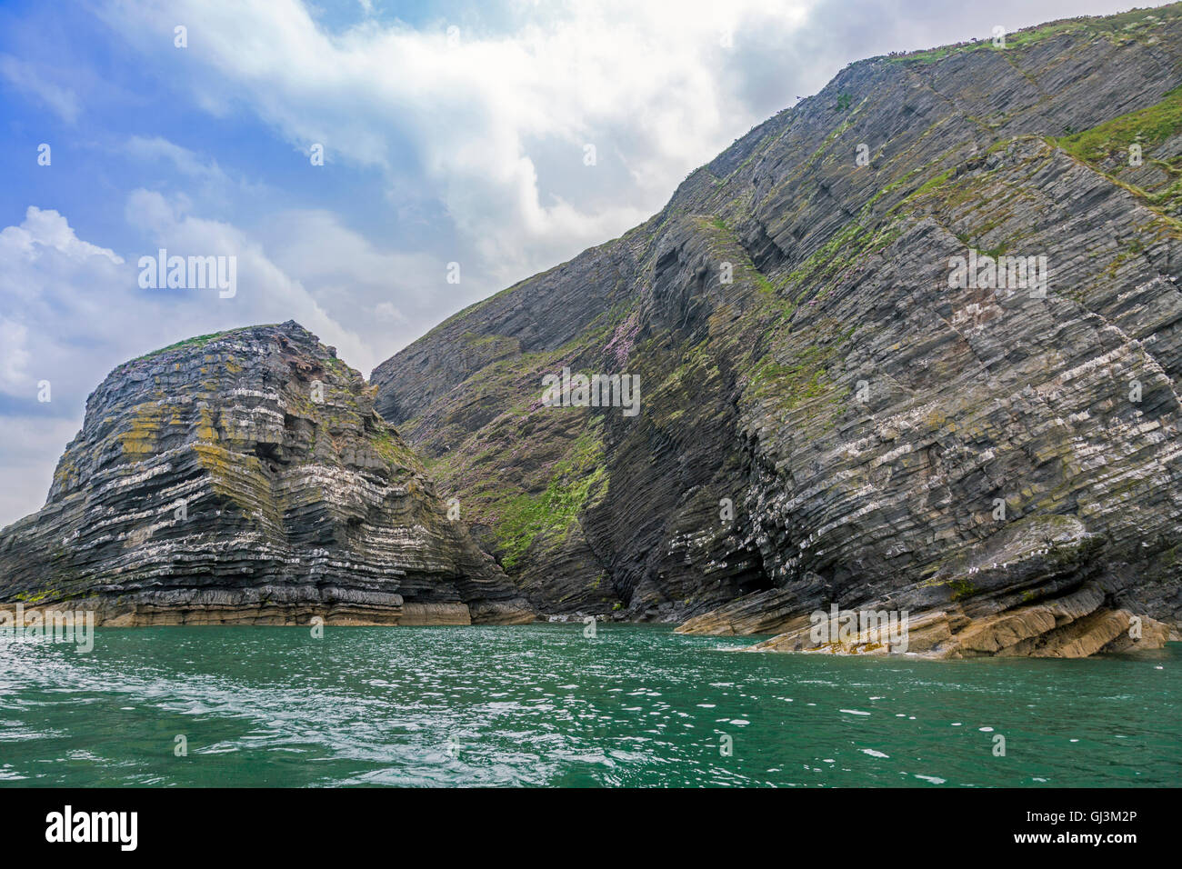 The towering sea cliffs at Carreg Walltog near New Quay, Ceredigion ...