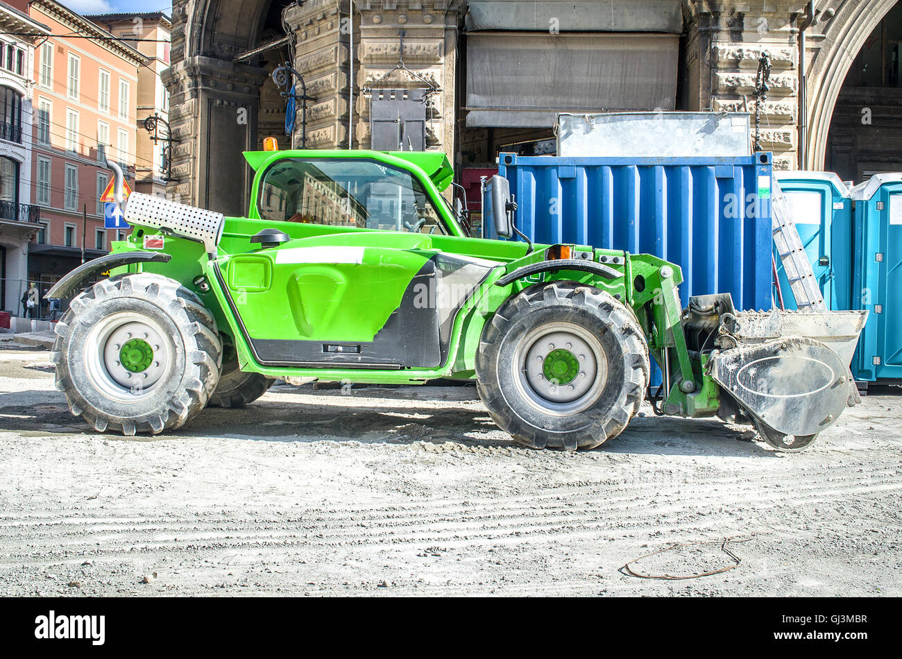 Bologna, Italy - March 7, 2015: green bulldozer in construction site ...