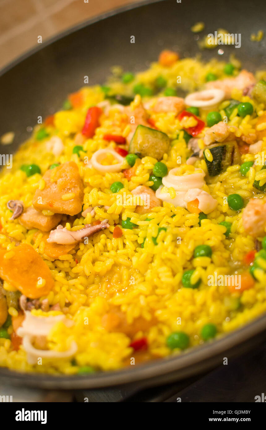 cooking valencian paella spanish seafood rice recipe Stock Photo - Alamy
