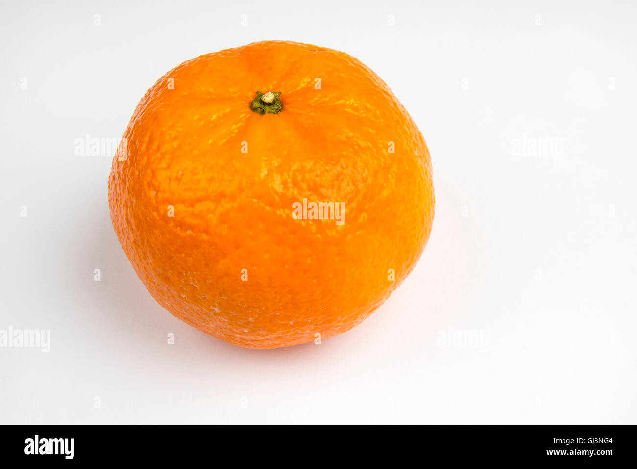 Single juicy orange fruit on a white background Stock Photo - Alamy