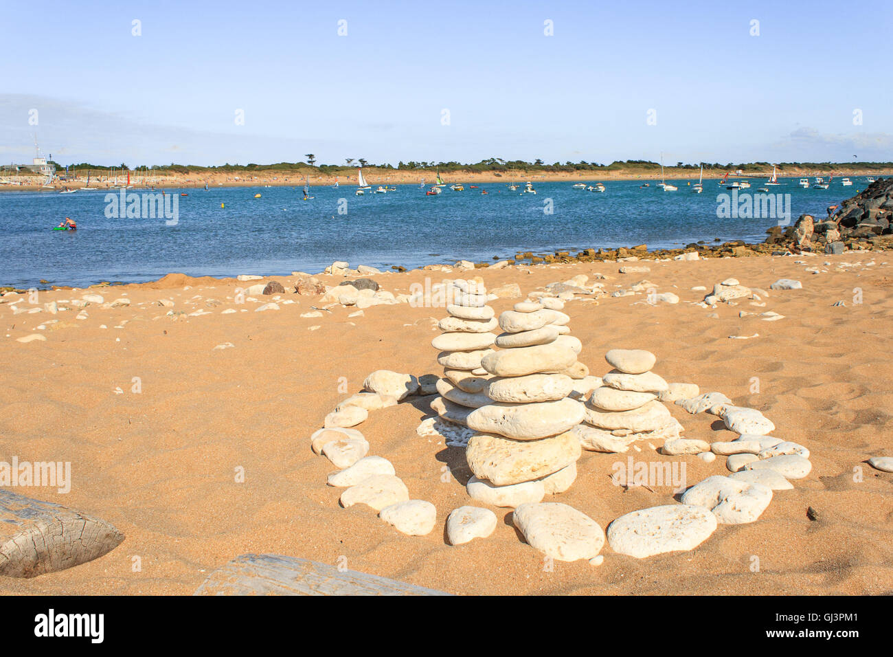 Stacked stones cairn on the beach in France Stock Photo - Alamy